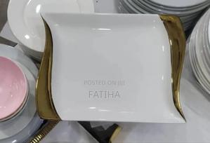 A Dozen of Rectangular Dinner Plates With Gold Design in Central ...