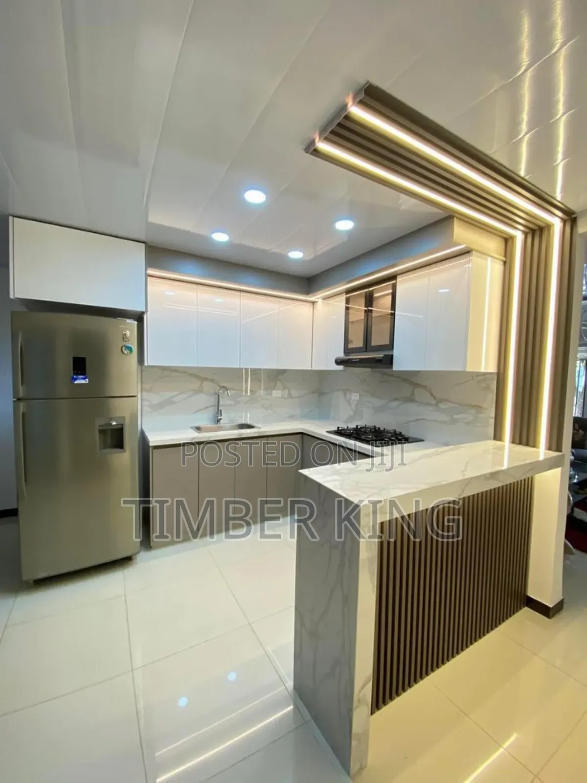 Well-Lit Kitchen Cabinets Featuring a Prominent Kitchen Island. in ...