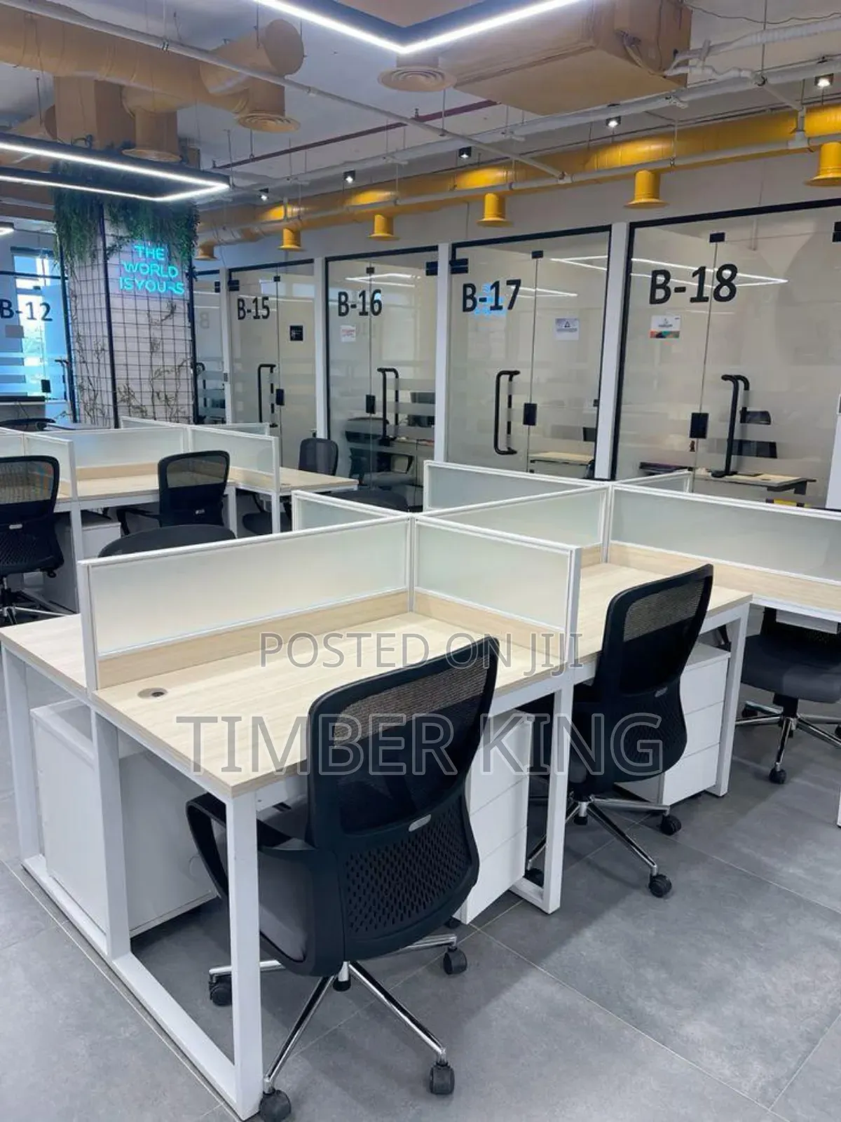 Modern, Open-Plan Office Space Featuring Several Cubicles in Central ...