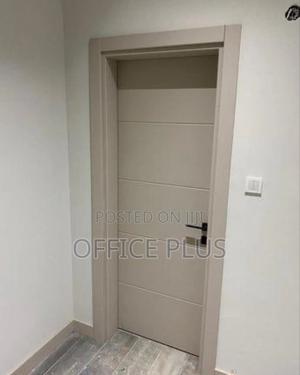 Modern Interior Door With Horizontal Grooves and a Black Lever Handle ...